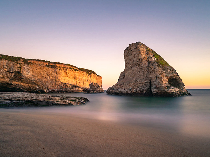 That's not a movie prop – Shark Fin Cove's namesake rock formation is Mother Nature showing off.