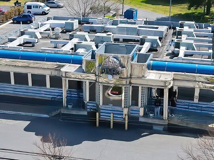 Silver Moon Diner (aerial view): "From above, it looks like a silver spaceship of sustenance. Inside, the gravitational pull of their meatloaf is scientifically proven." 