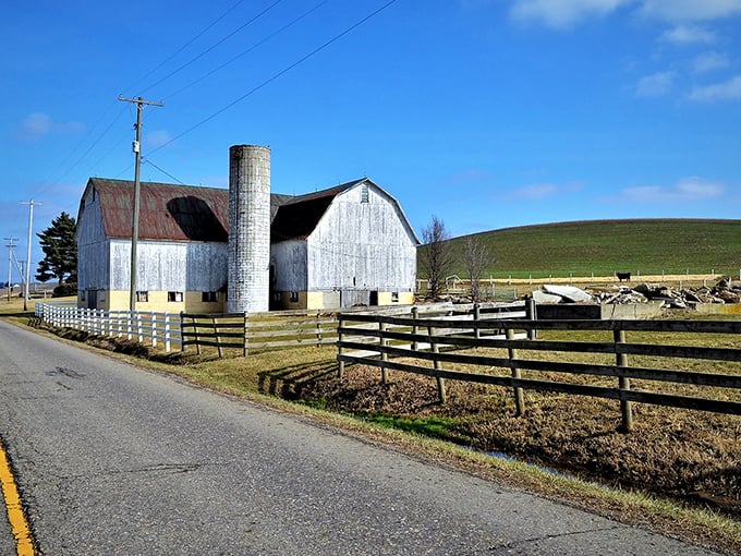 This weathered barn stands sentinel over Sugarcreek's countryside, a silent storyteller of generations of farming traditions.