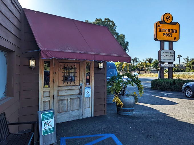 That rustic red awning beckons like a beacon for barbecue lovers - this is where movie magic meets mesquite-grilled reality.