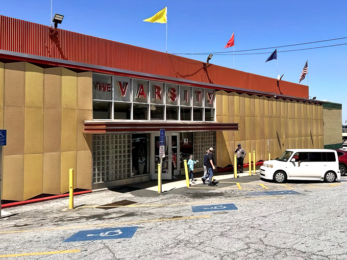 The Varsity stands proud like a retro palace, flying its flags high &ndash; an Atlanta landmark serving nostalgia between buns.