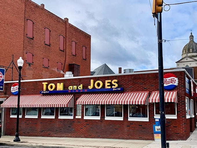 Tom & Joe's brick facade and classic neon signage beckon like an old friend, promising the kind of honest food that doesn't need fancy descriptions on the menu.