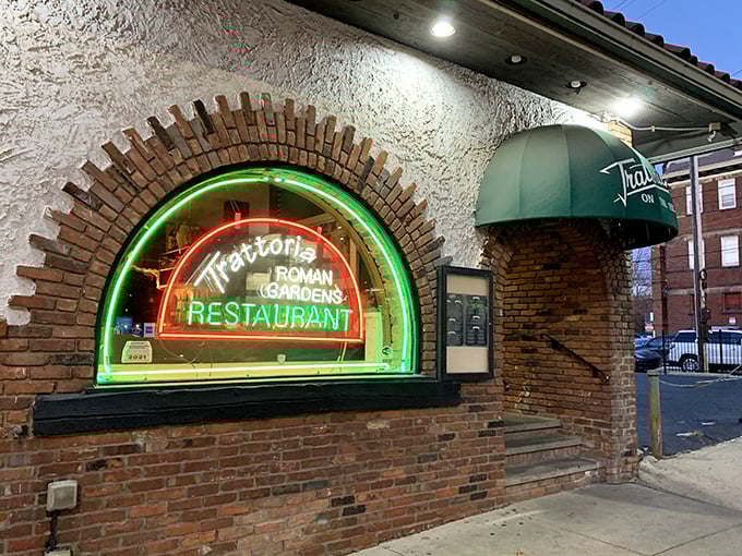 That glowing neon arch at Trattoria Roman Garden isn't just a sign&mdash;it's a portal to pasta paradise.