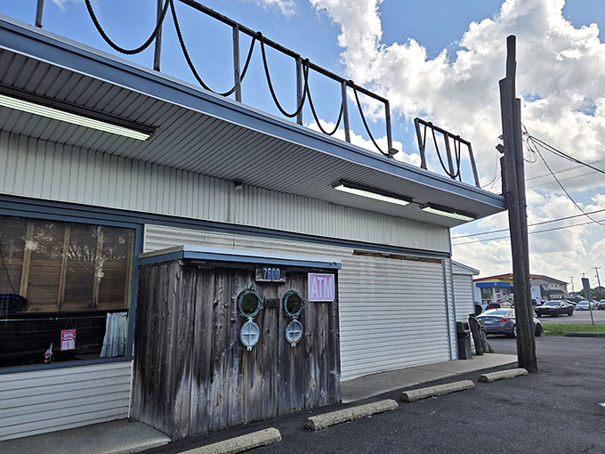 Under the Pier (exterior with ATM): "Those porthole doors aren't just decorative&mdash;they're your gateway to seafood nirvana hiding in plain sight!"