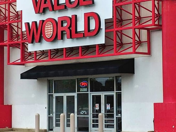 Value World's bold red signage towers like a beacon for bargain hunters who know true wealth comes from smart shopping.