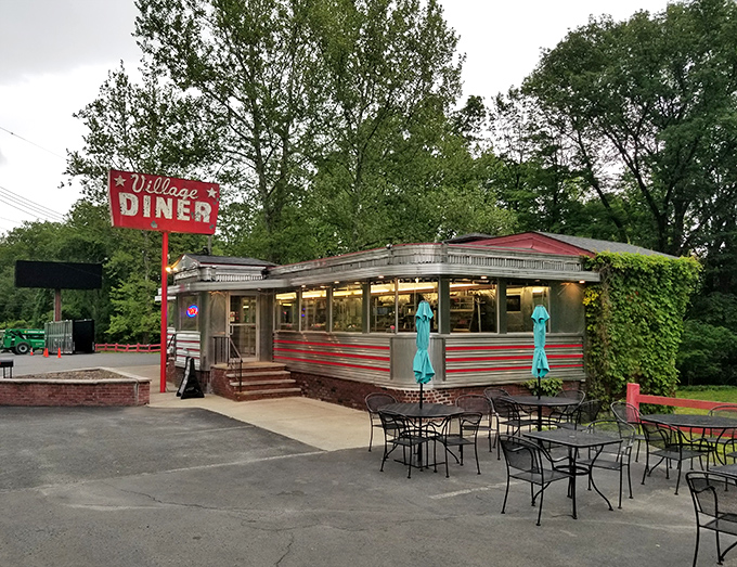 Classic Americana at its finest! Village Diner's shiny exterior is like a time machine with a side of home fries.