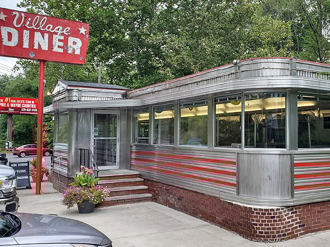 Village Diner's red trim pops against the silver exterior &ndash; like lipstick on a chrome-plated movie star from the golden age.