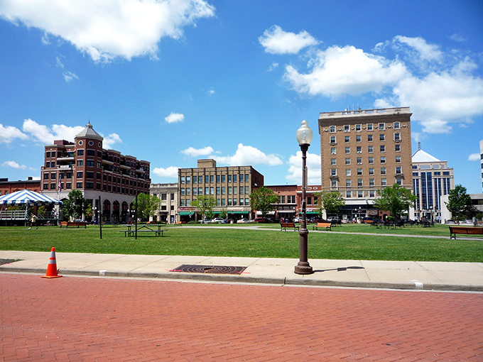 Downtown Wausau's skyline shines under blue skies. That green space is the community's living room, where strangers become neighbors.