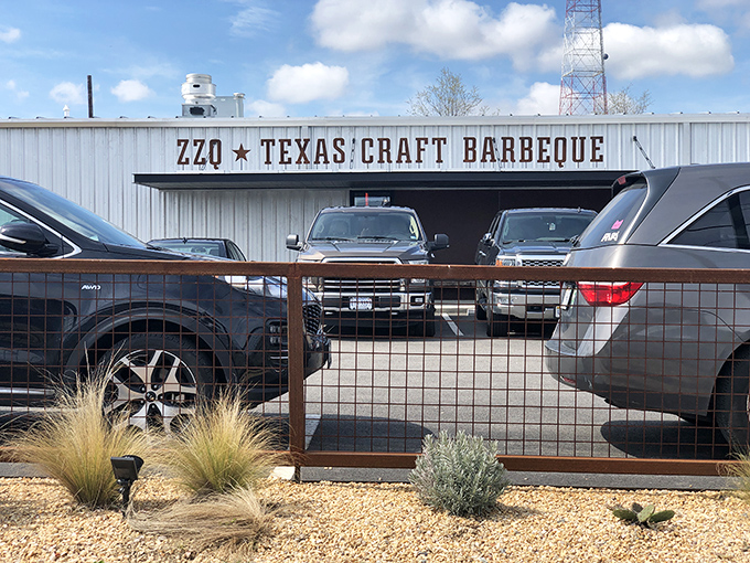 ZZQ's industrial exterior hides Texas-sized flavors. That line of cars? The best review a barbecue joint could ask for.