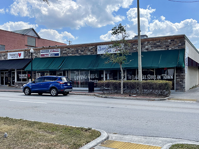 The "Cleanest Dive in Town" sign promises affordable eats in Avon Park, where local diners serve up hearty meals without the tourist-town prices.