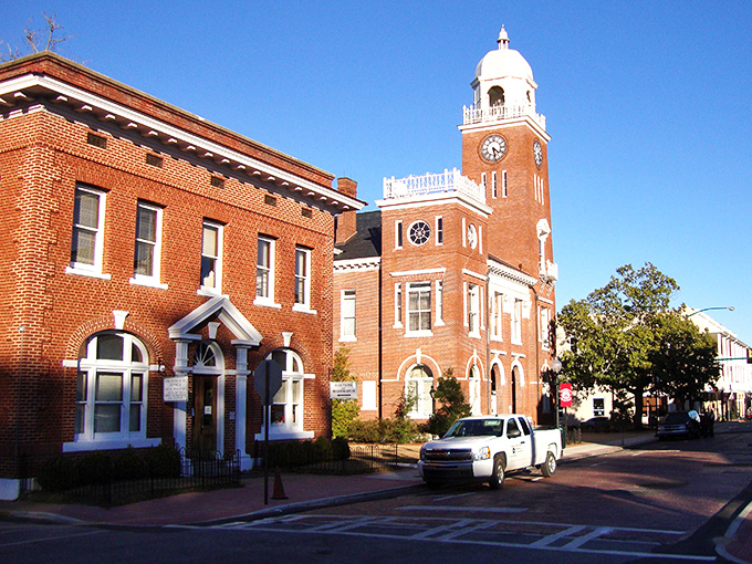 The courthouse clock tower stands proud as a lighthouse, guiding locals through their daily routines with timeless elegance.