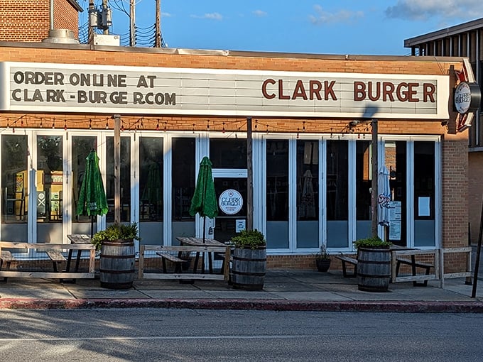 Outdoor barrel tables at Clark Burger invite you to linger over your meal. Urban dining with a touch of rustic charm.