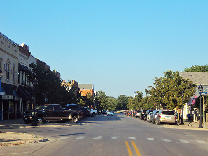 Elk Rapids: Sunlight bathes these classic storefronts where locals chat about everything except rush hour—because there isn't one.