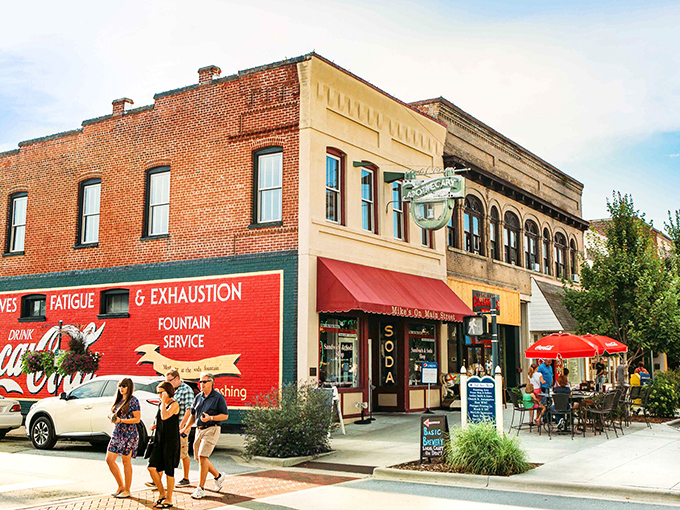 That classic Coca-Cola mural isn't just advertising; it's a time machine to when downtown was America's living room.