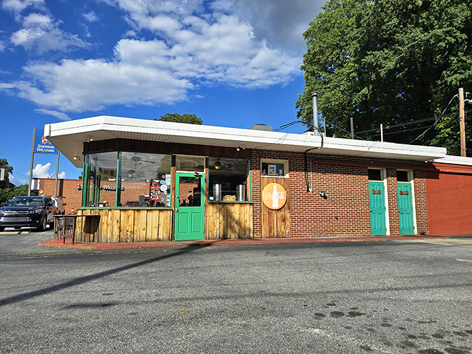 Those bright green doors? Consider them portals to pork paradise, where hickory smoke perfumes the air like nature's cologne.