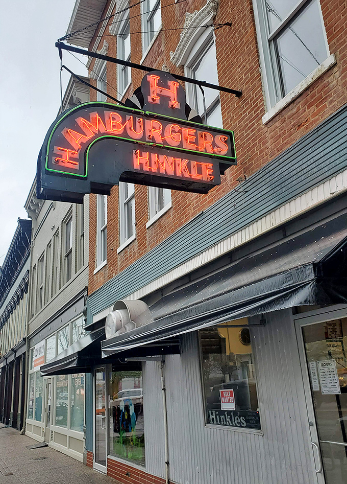 The vintage Hinkle's Hamburgers sign illuminates downtown Madison like a retro bat signal for the sandwich-obsessed.