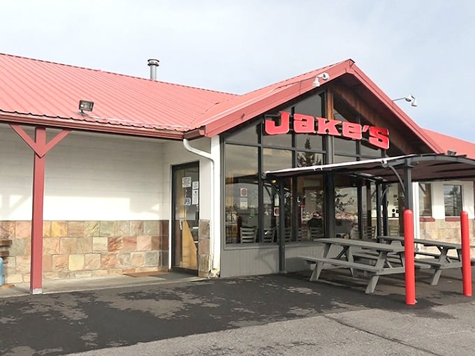 The stone facade and picnic tables at Jake's Diner promise a no-frills feast worth pulling over for.