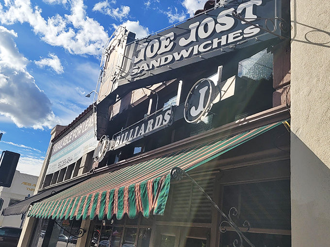That striped awning isn't just charming - it's a beacon for generations of Long Beach locals seeking hot dog perfection.