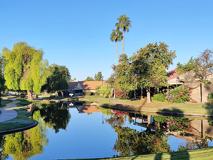 Walking paths that invite daily strolls. The reflections in Leisure World's calm waters double the beauty of Arizona's famous blue skies.