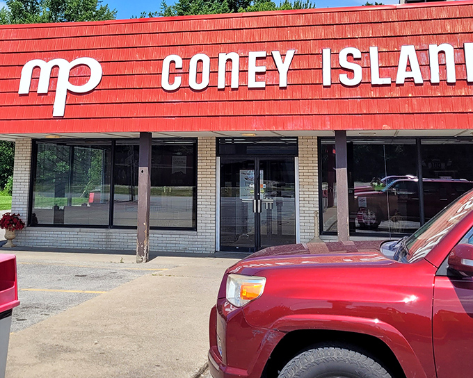 The classic storefront of M+P Coney Island promises simple pleasures done right – where hot dogs are still the star of the show.