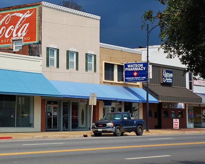 The vintage Coca-Cola sign watches over Marianna's main street, where local businesses thrive in historic buildings.