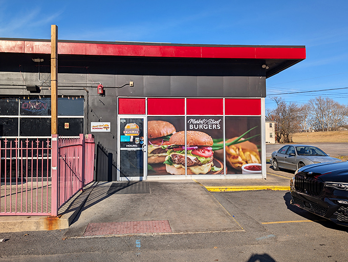 The striking black and red color scheme isn't just for show &ndash; it's advertising the sizzling experience waiting inside.