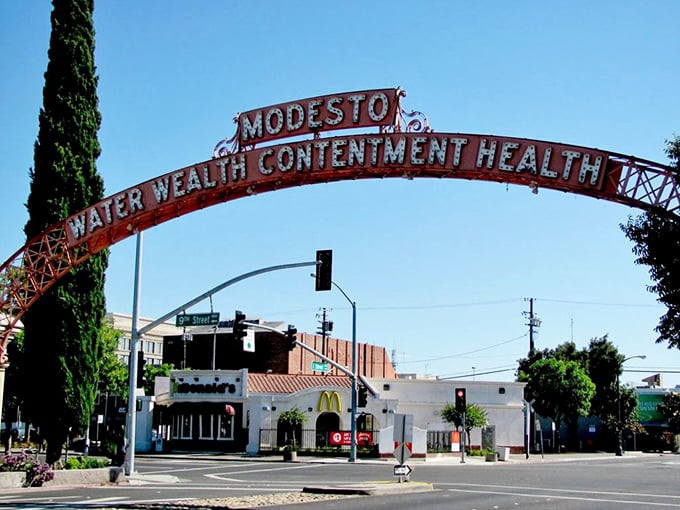 The iconic Modesto arch proudly announces "Water, Wealth, Contentment, Health"&mdash;the world's most optimistic welcome sign.