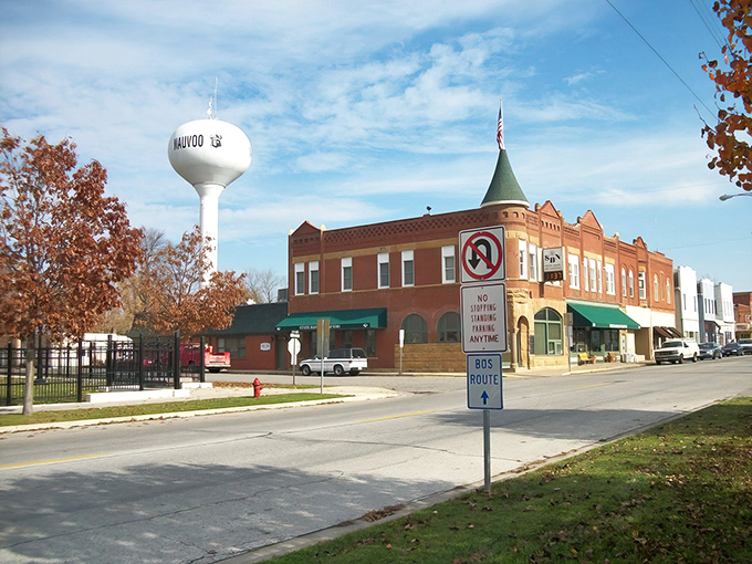 The red brick buildings of Nauvoo stand proudly against blue skies, like architectural time travelers from the 1840s.