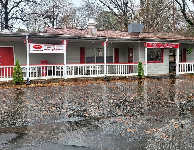 Rain or shine, this cozy roadside haven serves up Coney dogs worth driving for. The red trim promises spicy delights within.