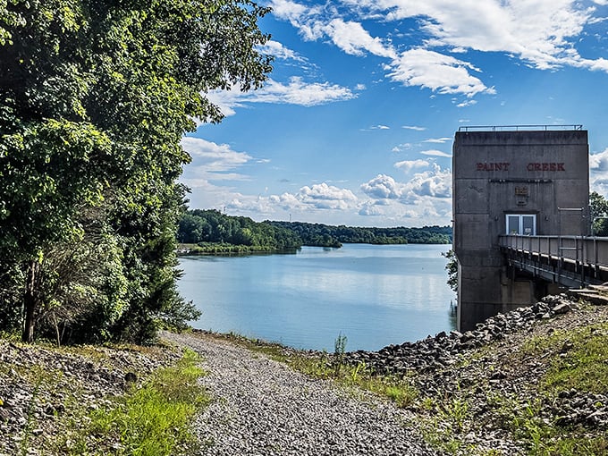 The Paint Creek dam stands guard over waters that reflect clouds like nature's own Instagram filter. Engineering meets serenity!