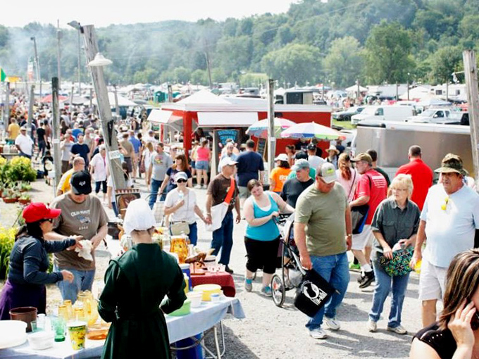 Deal-making under the Ohio sky! Rogers Market vendors display their wares as shoppers hunt for that perfect something they didn't know they needed.
