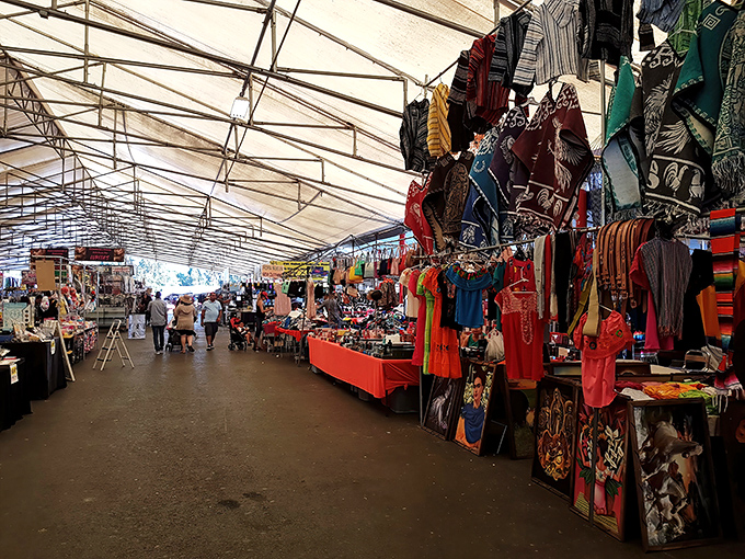 Market fashion district! The covered walkways of San Jose Flea Market offer a rainbow of textiles where bargain hunters can refresh their wardrobes without emptying their wallets.