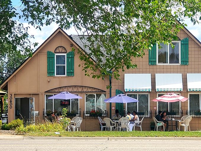 Purple umbrellas and outdoor seating at The Breakfast Club create the perfect setting for people-watching while devouring those famous pancakes.