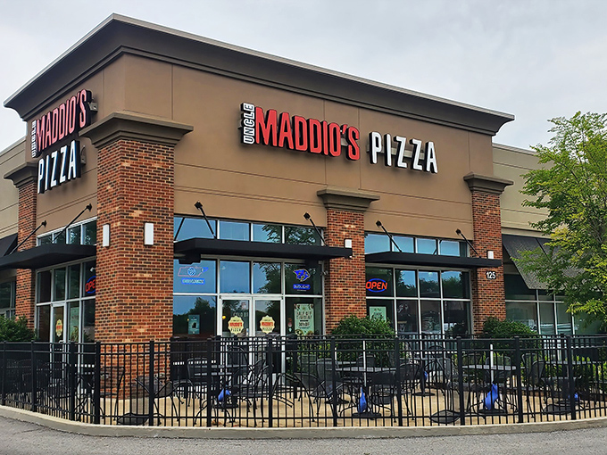 Pizza Palace's vintage sign stands like a neon-lit time machine. This drive-in hasn't changed since your first car date—and that's precisely why we love it.