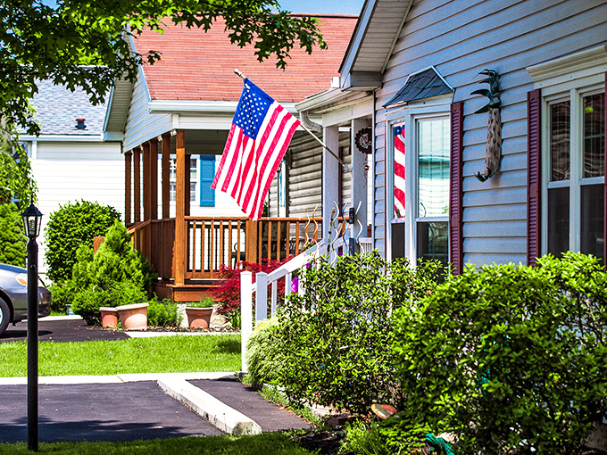 Stars and stripes flutter proudly over homes where patriotic spirit meets affordable retirement dreams beautifully.