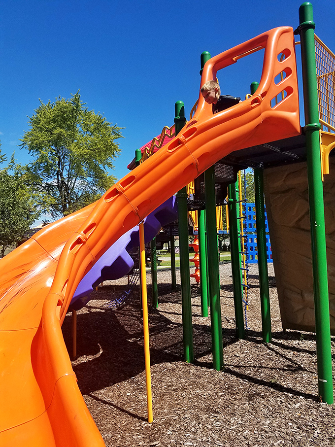 Childhood joy in technicolor! This playground slide promises the simple thrill that no video game can replicate.