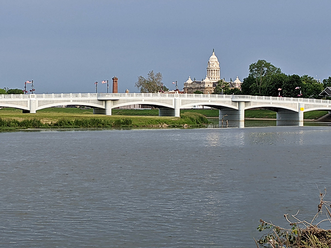 The Adams Street Bridge spans the Great Miami River, offering postcard-worthy views of Troy's iconic courthouse dome in the distance.