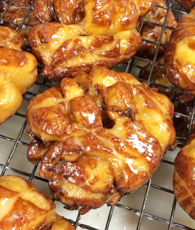 These apple fritters aren't just fried dough &ndash; they're edible works of art with a glaze so perfect it makes Renaissance painters jealous.