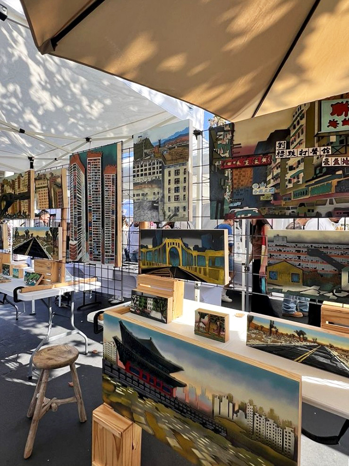 Urban landscapes come alive in this artist's booth, where cityscapes and architectural paintings await collectors with blank walls and bold tastes.