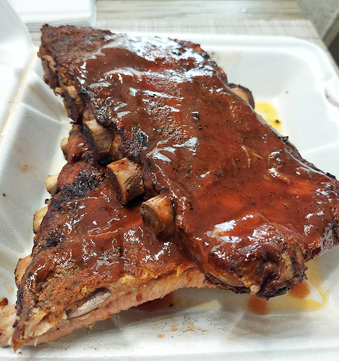 These ribs don't just fall off the bone&mdash;they practically leap into your mouth, glistening with that perfect lacquer of sauce and smoke.