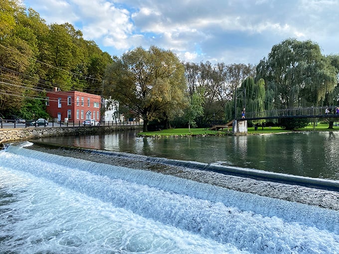The waterfront walkway offers nature's soundtrack&mdash;rushing water creating both tranquility and energy in the heart of town.