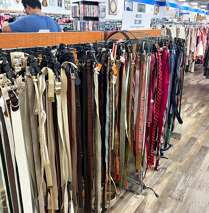 The belt collection dangles like a leather rainbow. Finding the perfect one feels like winning a small lottery you didn't know you entered.