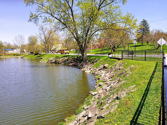 The serene waterfront at Cambridge City Park provides a peaceful retreat where locals gather for reflection, fishing, or simply watching ducks negotiate their own retirement plans.