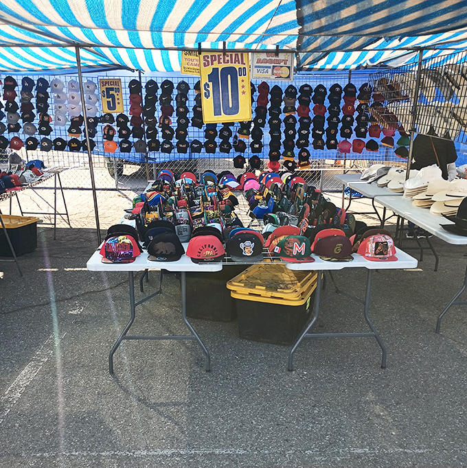 Hat heaven under a blue-striped canopy. Whether you're channeling your inner baseball fan or just need sun protection, there's a cap calling your name.