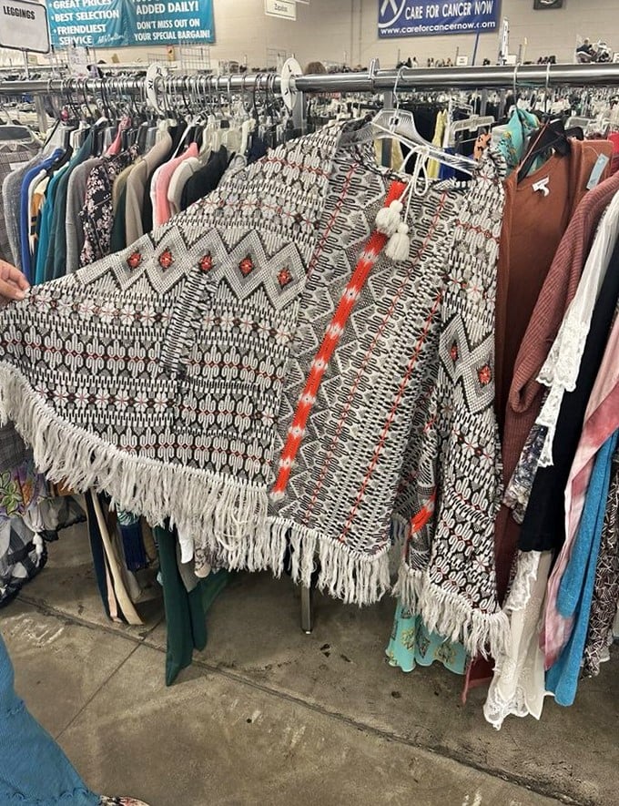 This isn't just a clothing rack &ndash; it's a textile time machine. That fringed poncho could have been at Woodstock or just waiting for your next music festival adventure.