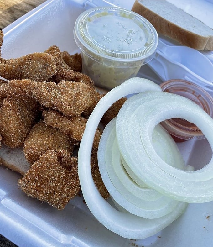 Golden-brown perfection that would make Midas jealous. These catfish fritters with fresh onion rings are the reason people drive for hours.