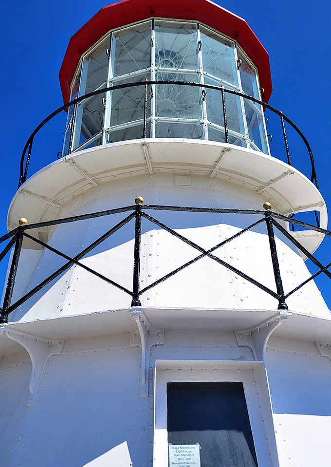 That distinctive red cap isn't just for show&mdash;it housed the original Fresnel lens that once guided ships through treacherous waters.
