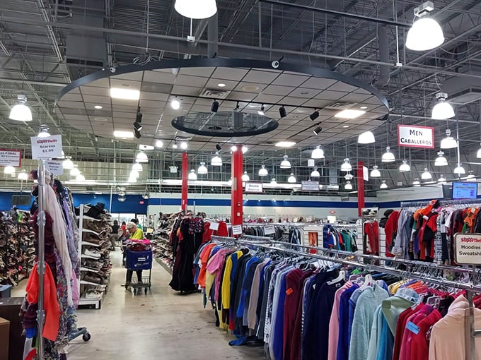 The clothing section features a circular centerpiece display that would make any department store jealous. Bargain fashion awaits!