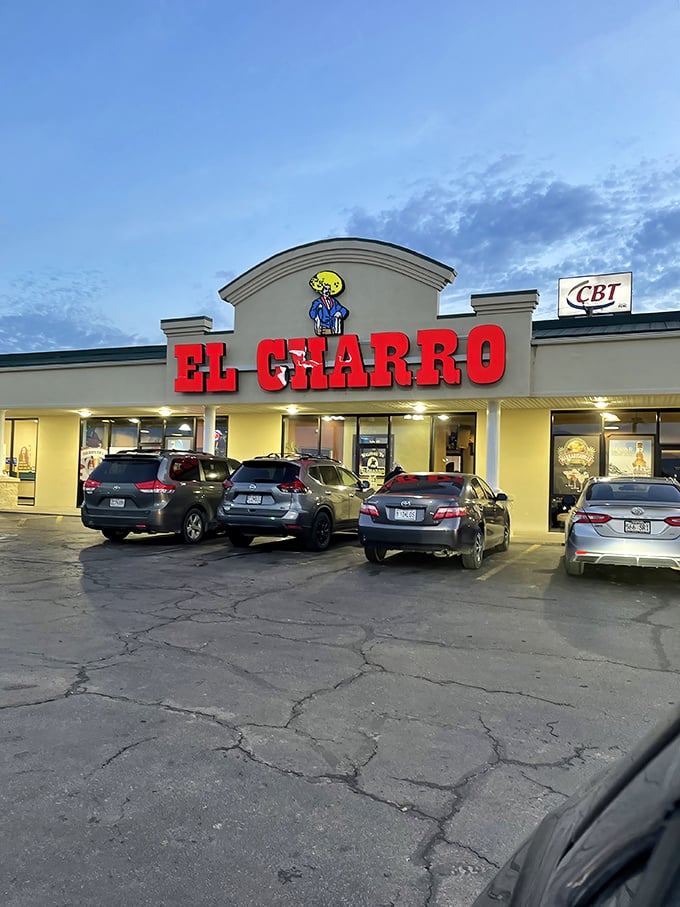 El Charro's glowing sign beckons hungry diners with the promise of authentic Mexican cuisine at prices that leave room in the Social Security budget for dessert.