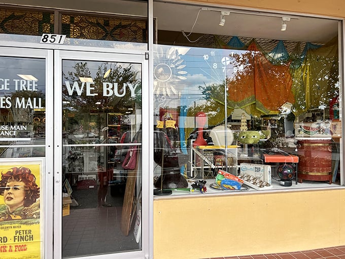 Step through these doors and kiss your afternoon goodbye. The "We Buy" sign should really add "and you'll definitely want to too."
